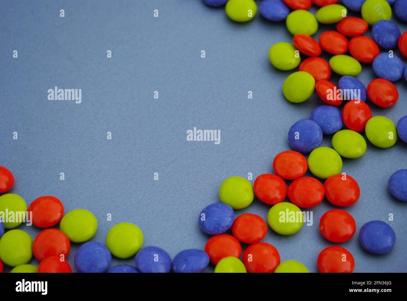 Colorful Halloween candy background orange blue green purple candy ...