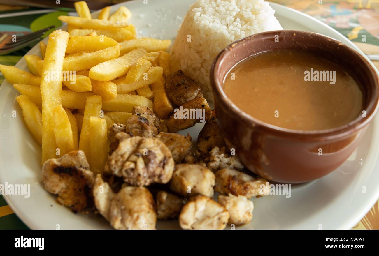 chicken with french fries, rice and beans. Typical Brazilian food Stock ...