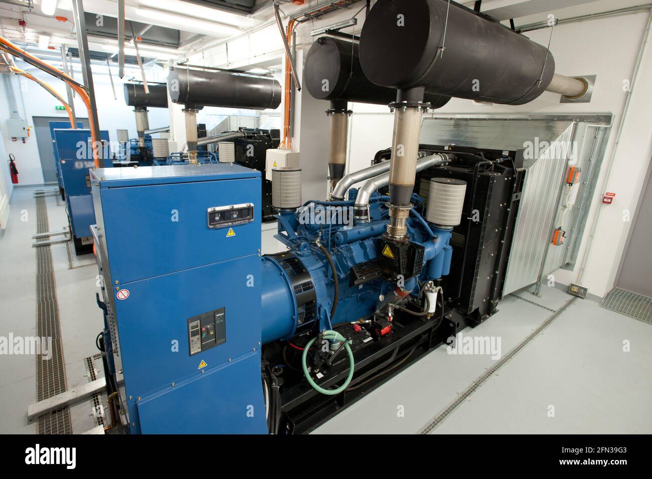 Backup electricity generator. Engine in blue color Stock Photo - Alamy