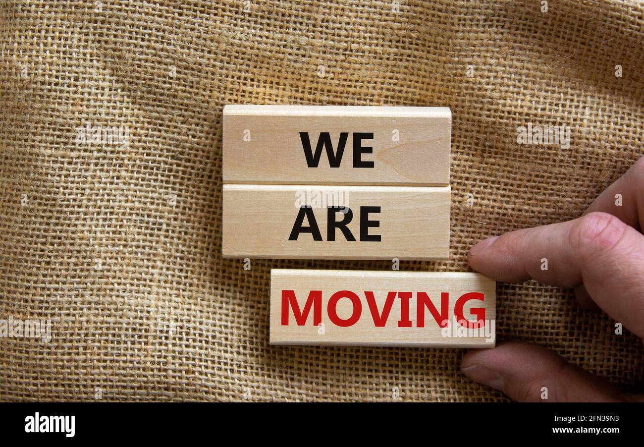 We are moving symbol. Wooden blocks with words 'We are moving ...