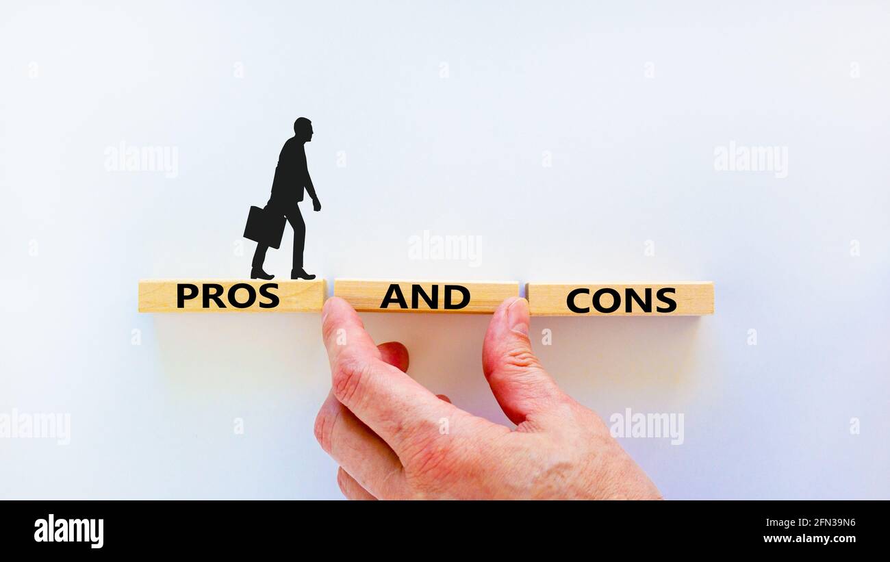 Pros and cons symbol. Wooden blocks with words 'Pros and cons ...