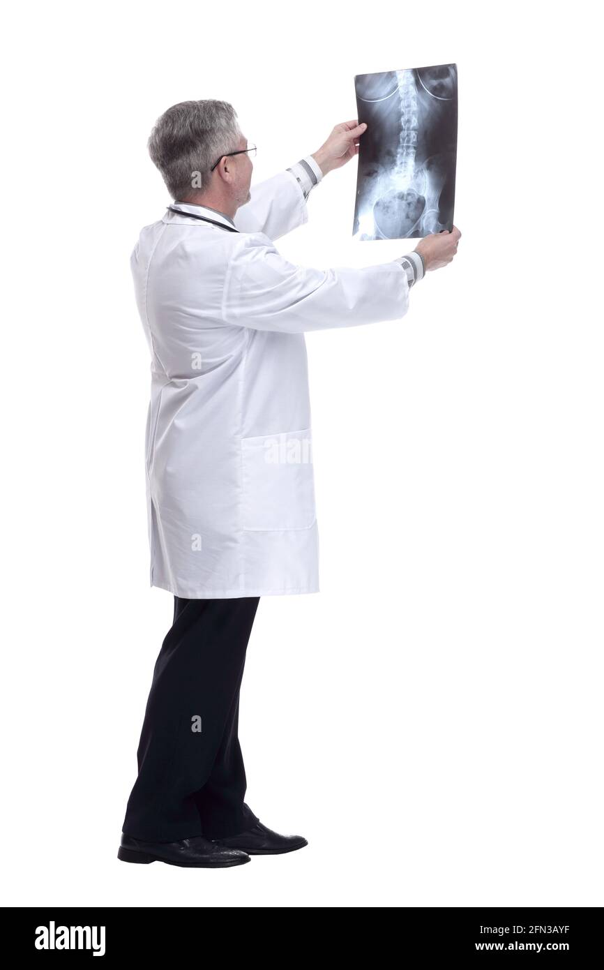 smiling doctor looking at the patient's x-ray . isolated on a white ...