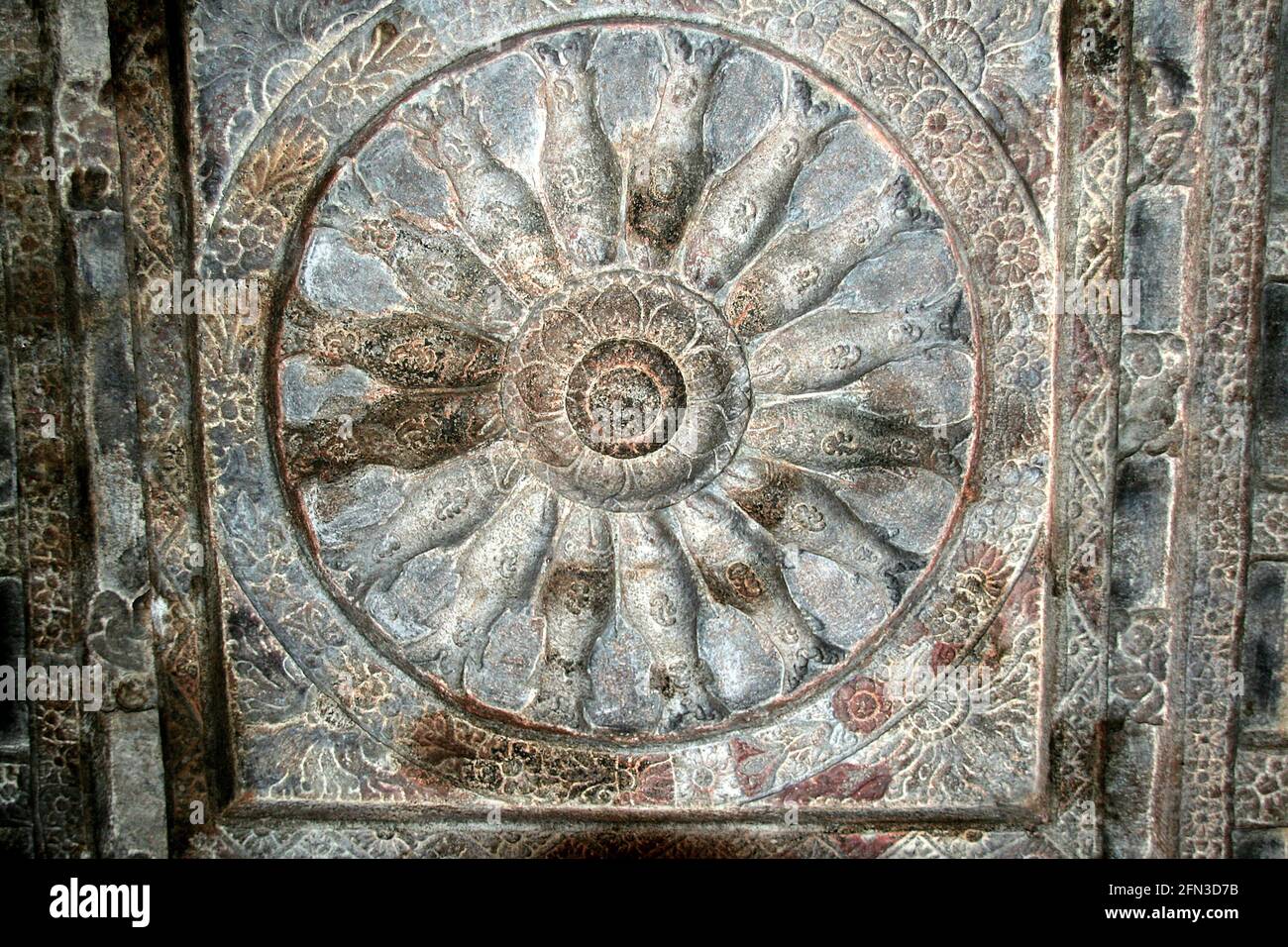 Wheel with fish-shaped spokes on the ceiling of cave temple at Badami ...