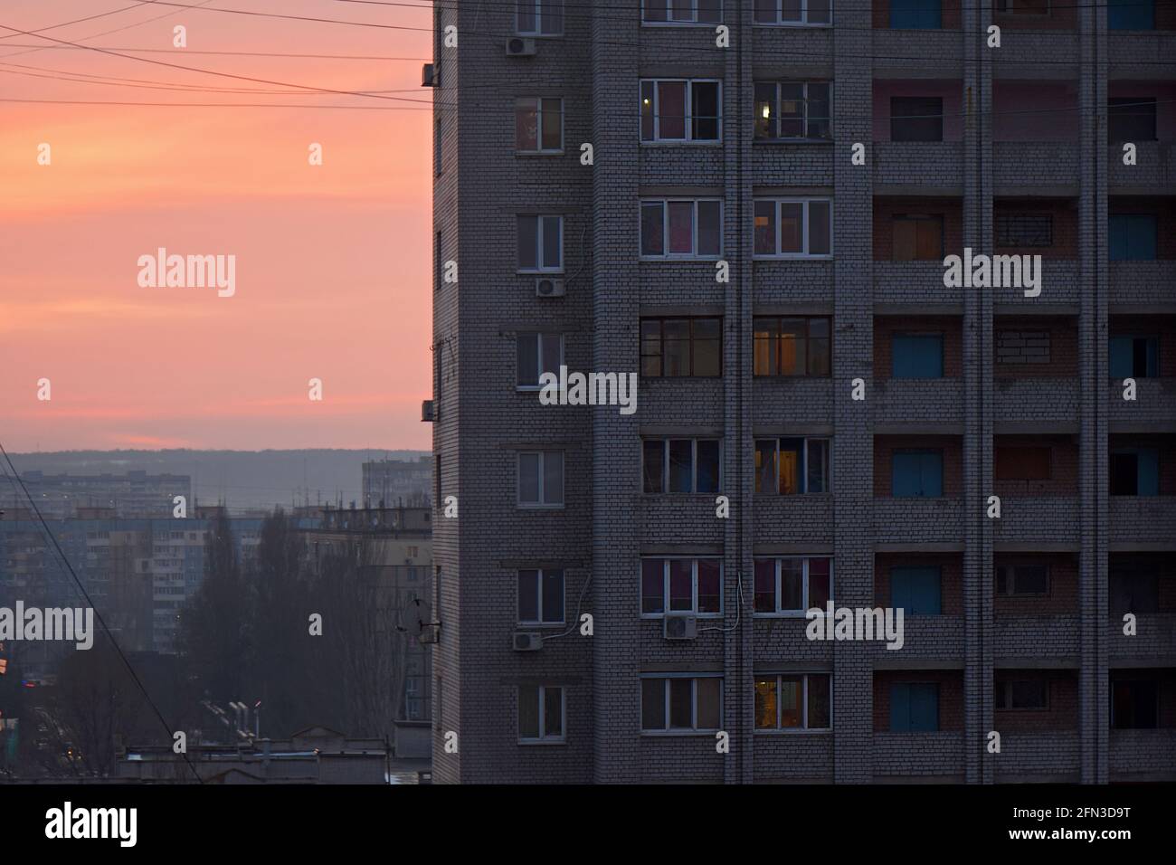 Apartment building at beautiful sunset Stock Photo - Alamy