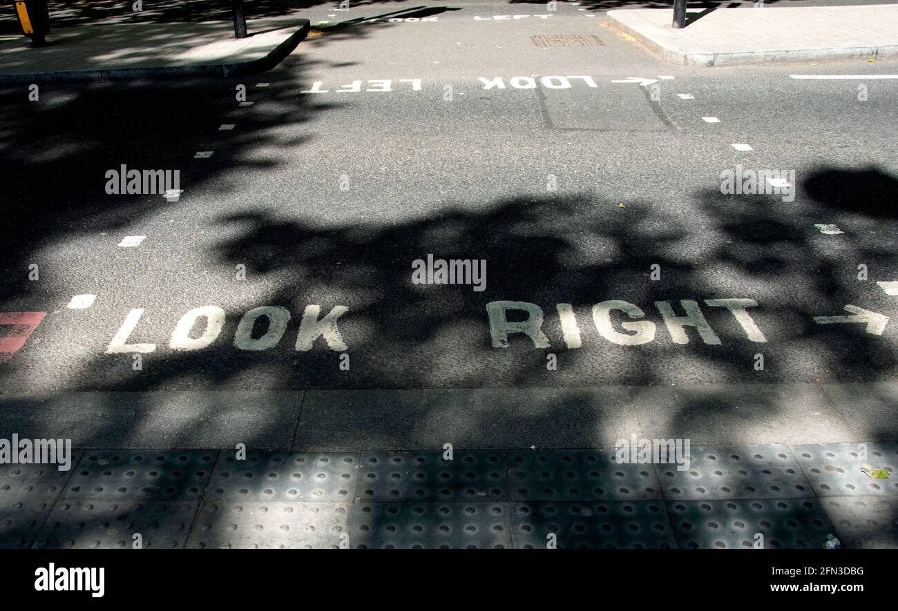 Signs on a London Street reminding you which direction to look Stock ...
