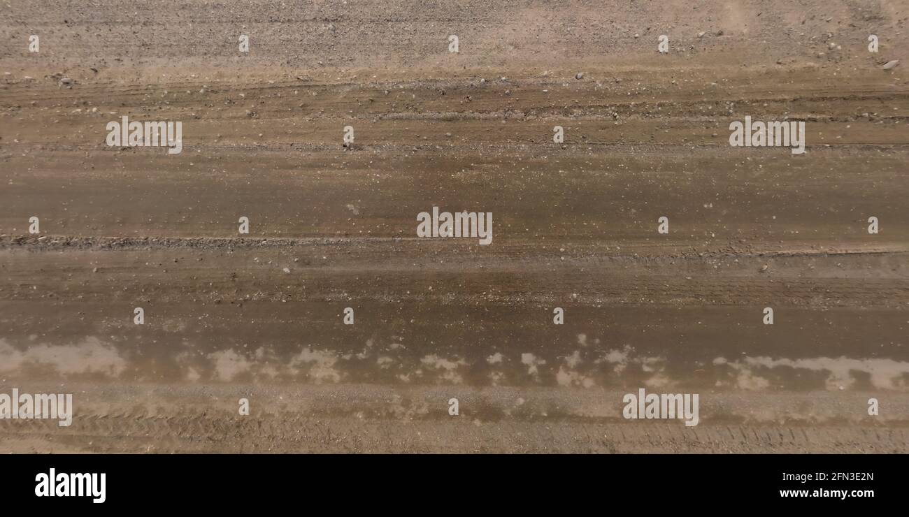 view from above on car tire tracks on texture of gravel road Stock ...