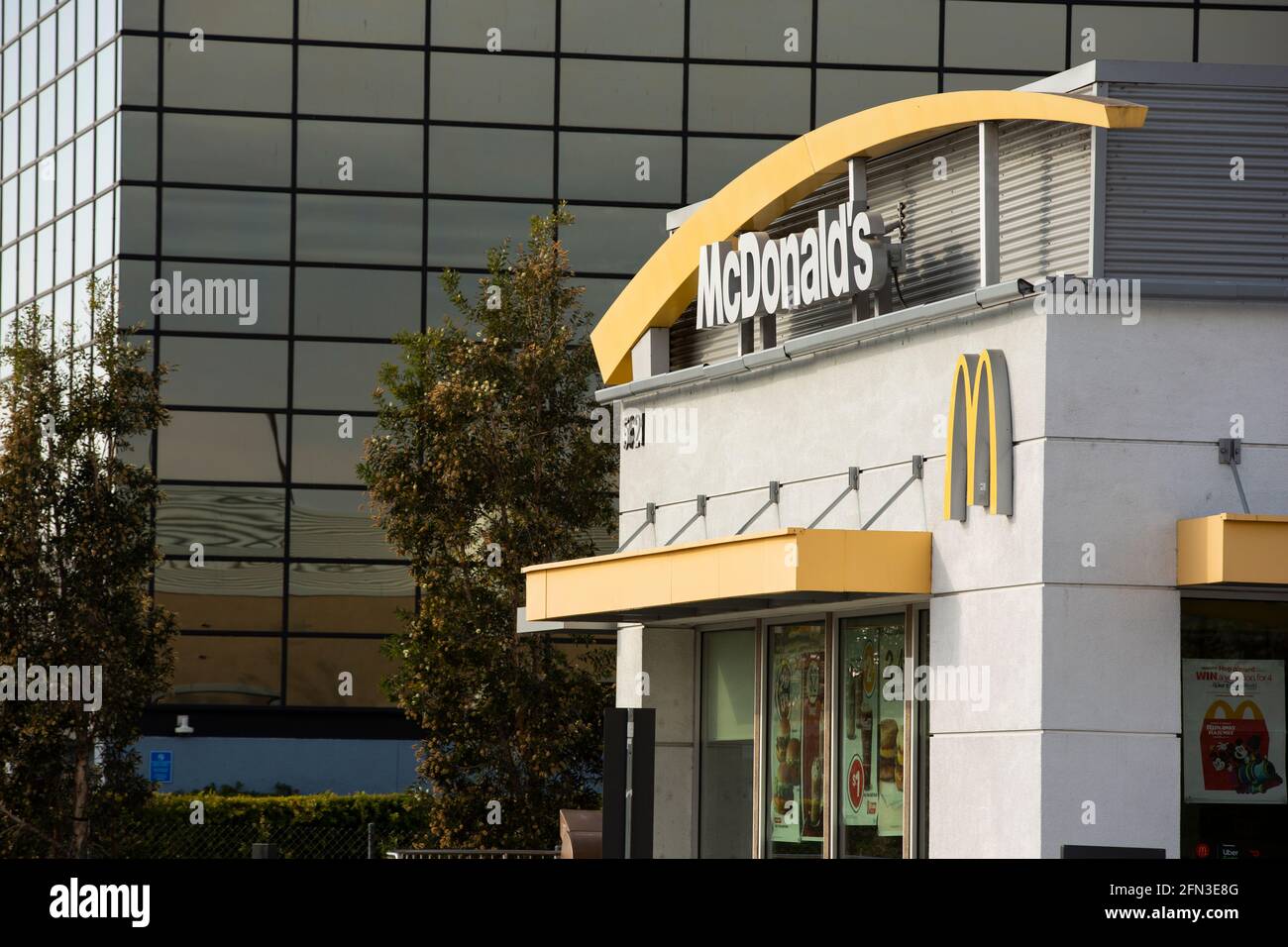 Anaheim, California, USA - December 12, 2020: Sun shines on a McDonald ...