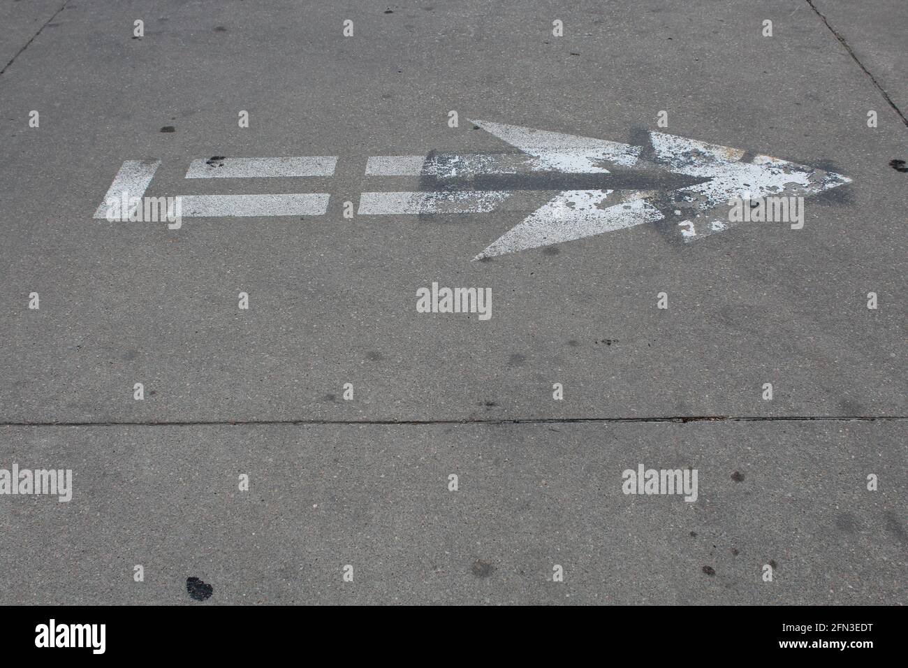 Painted arrow in parking lot directing traffic where to park Stock ...