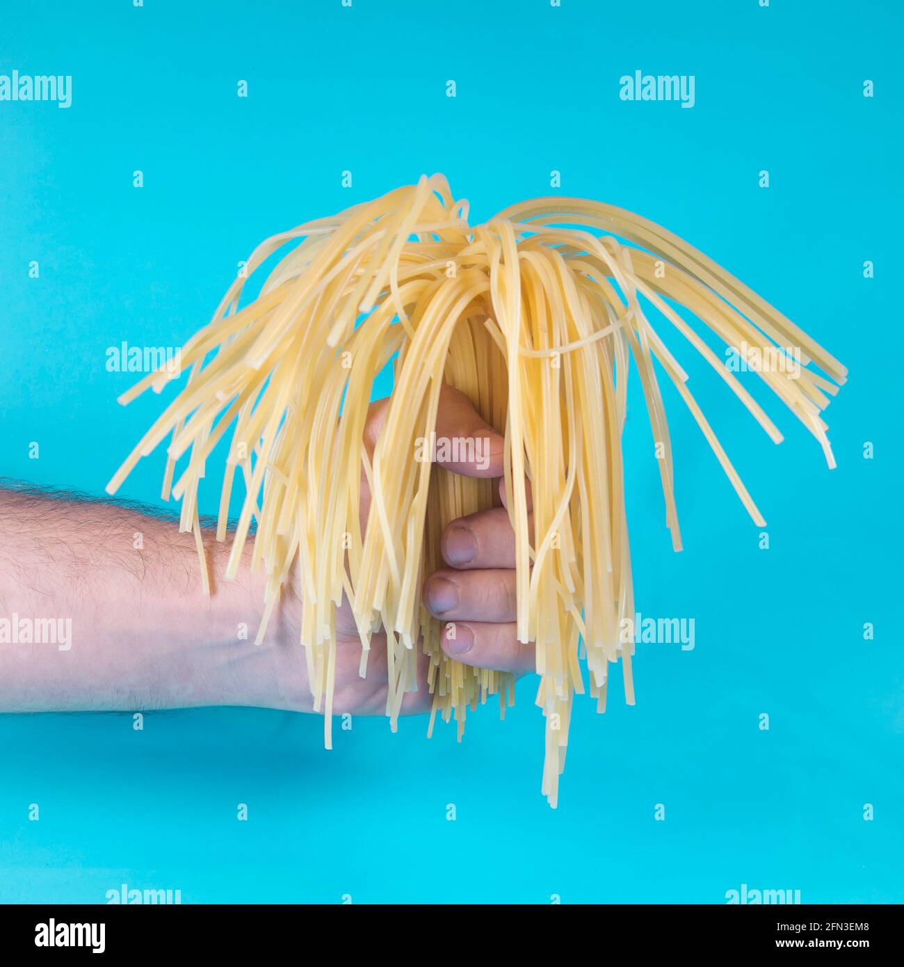 Hand with spaghetti hi-res stock photography and images - Alamy