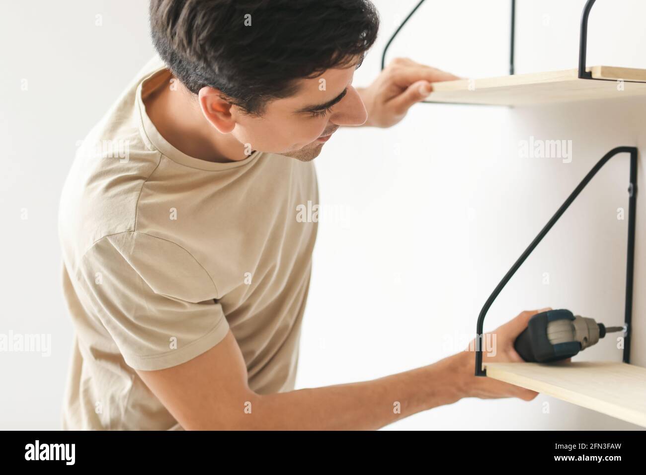 Installing shelves hi-res stock photography and images - Alamy