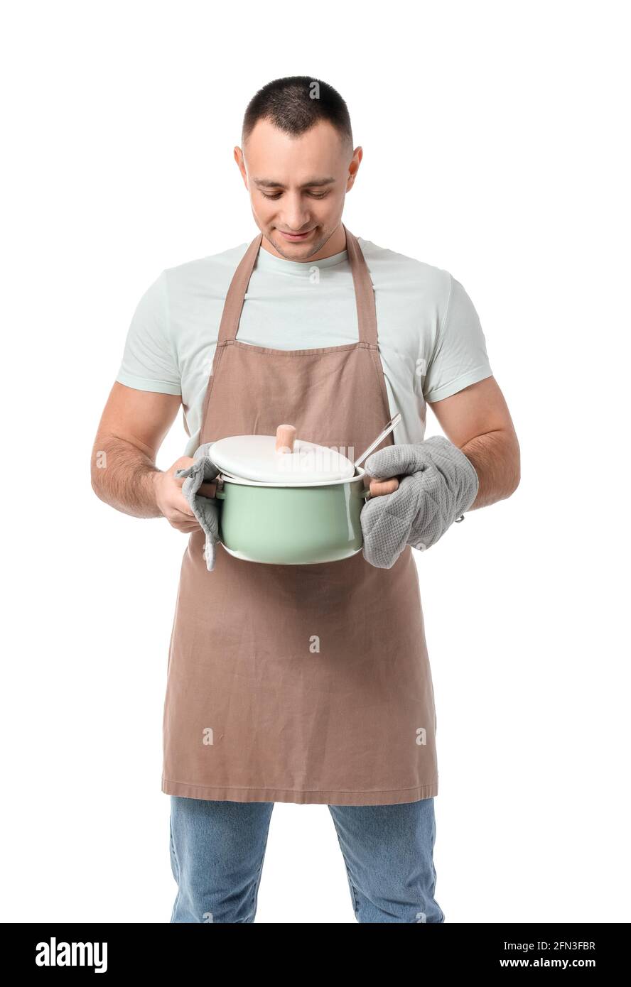 Young man with cooking pot on white background Stock Photo - Alamy