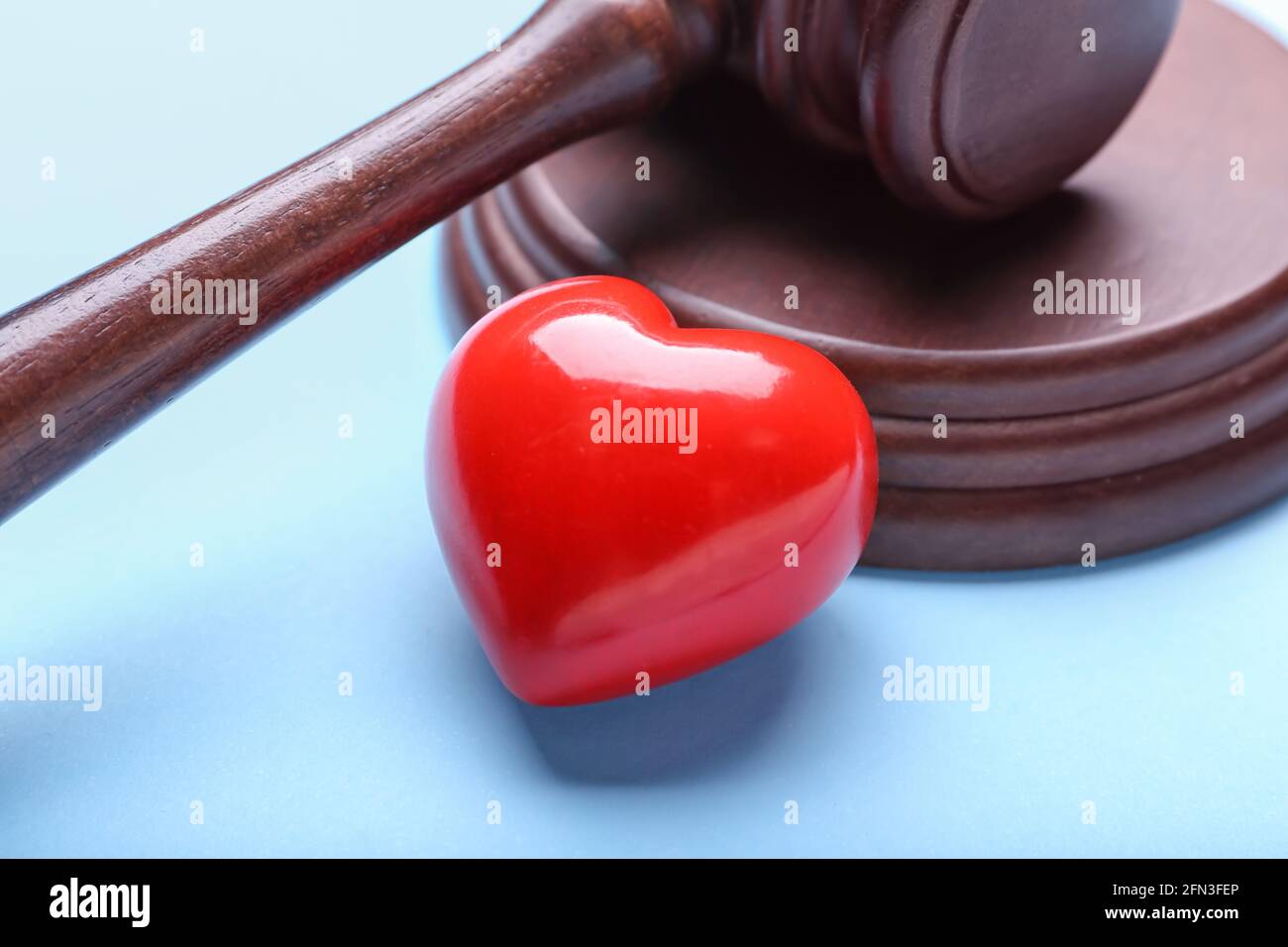 Judge's gavel and heart on color background, closeup Stock Photo - Alamy