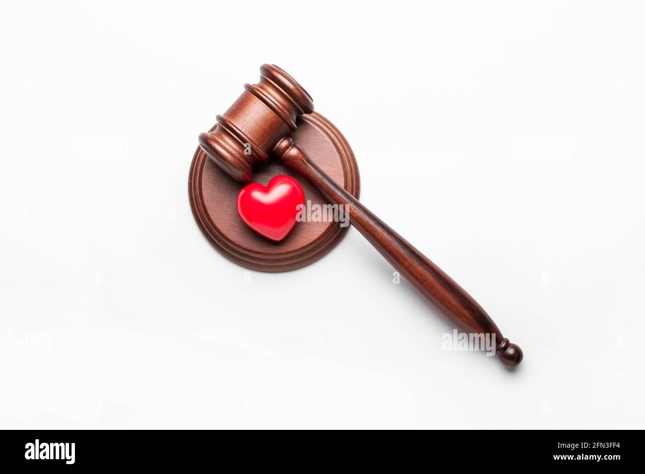 Judge's gavel and heart on white background Stock Photo - Alamy