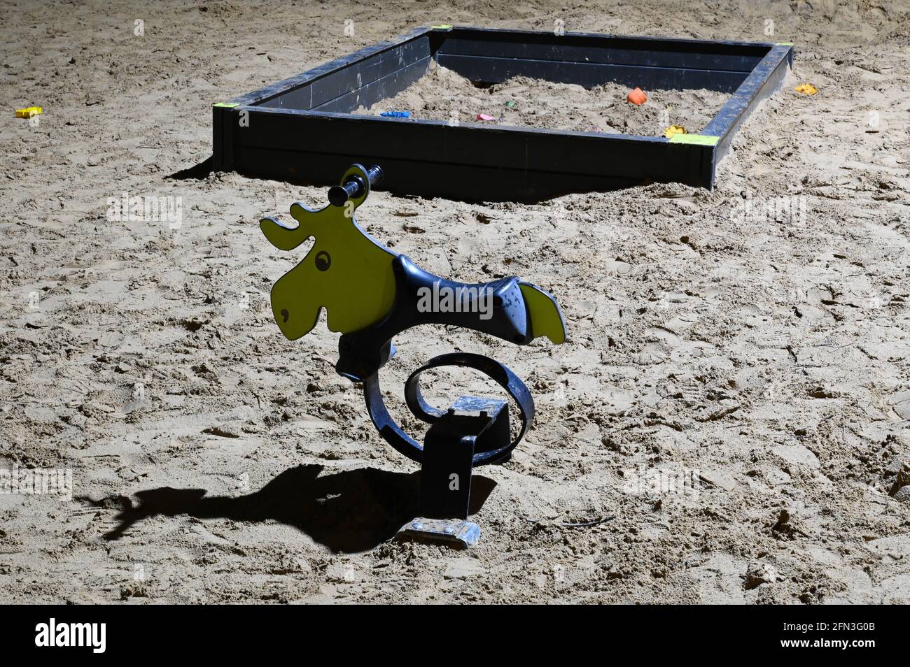 Rocking horse in playground hi-res stock photography and images - Alamy