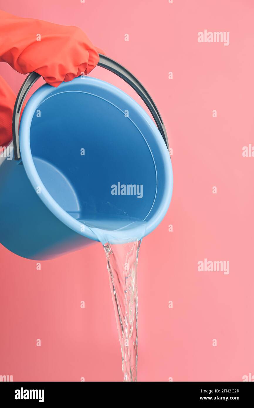 Pouring water from bucket hi-res stock photography and images - Alamy