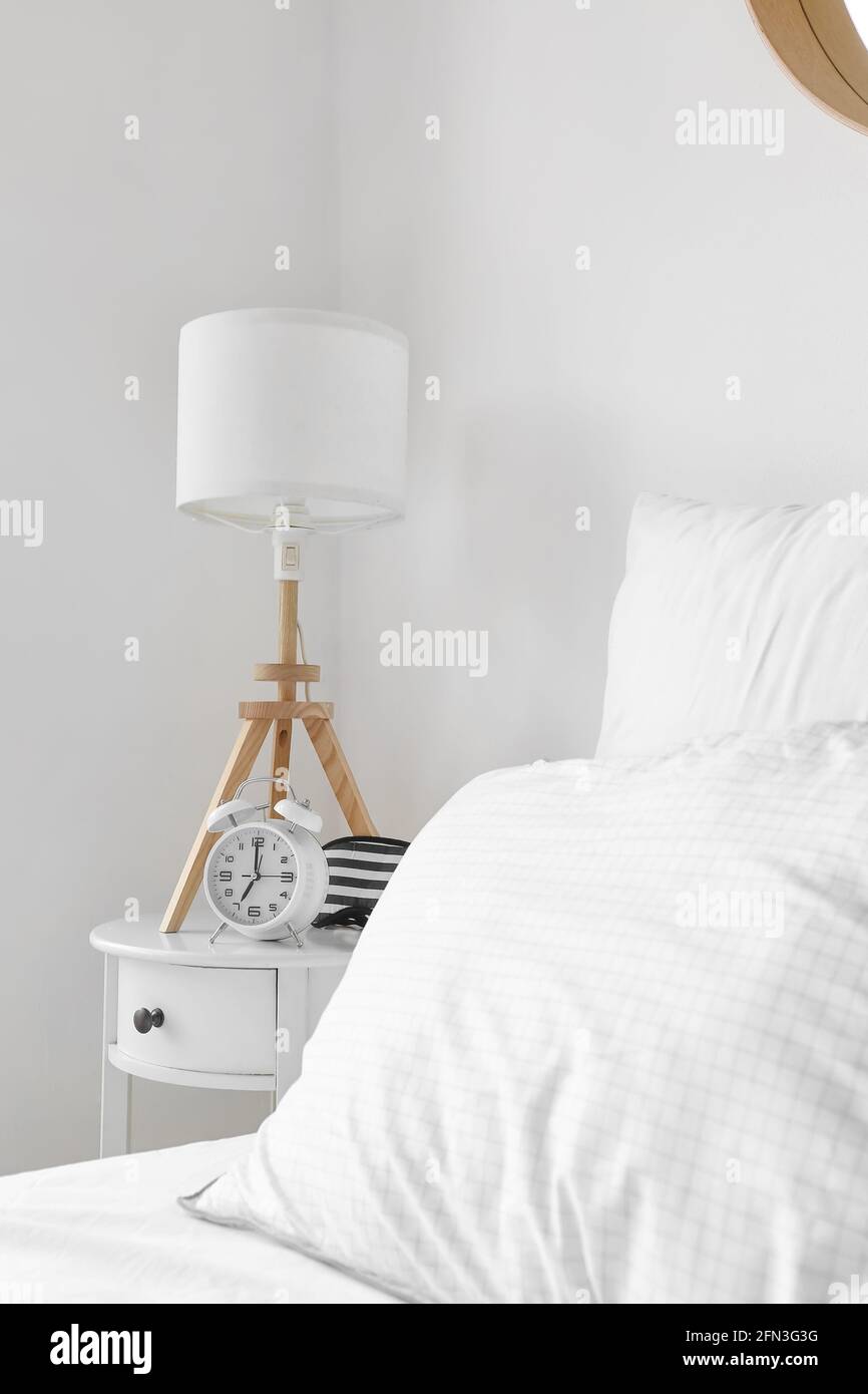 Alarm clock in interior of modern room Stock Photo - Alamy