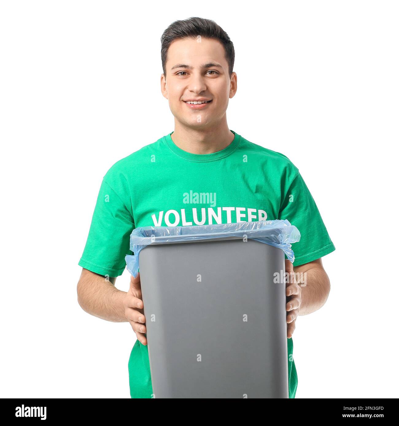 Male volunteer with trash bin on white background Stock Photo - Alamy