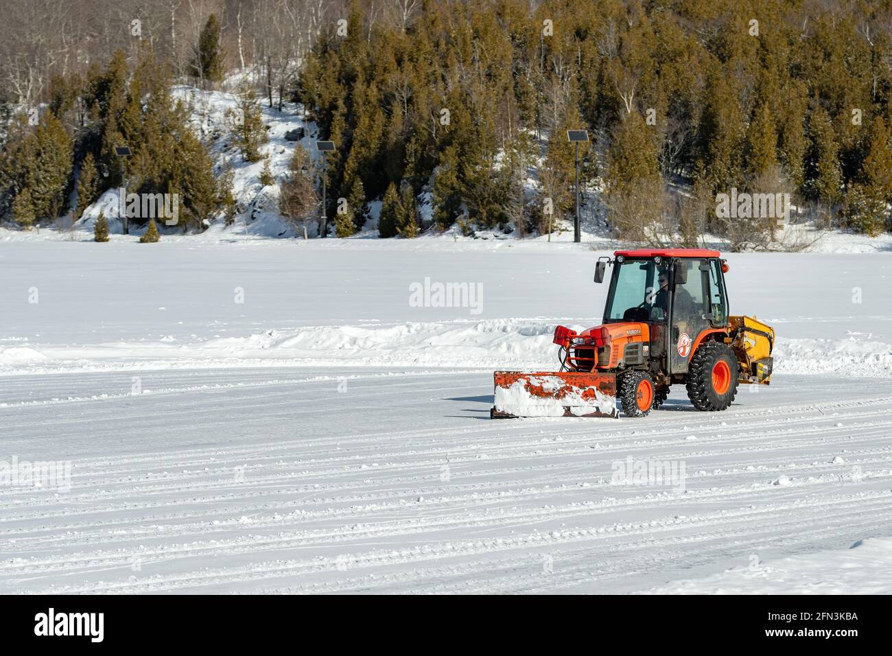 Saint John, NB, Canada - February 21, 2021: A small municipal plow ...
