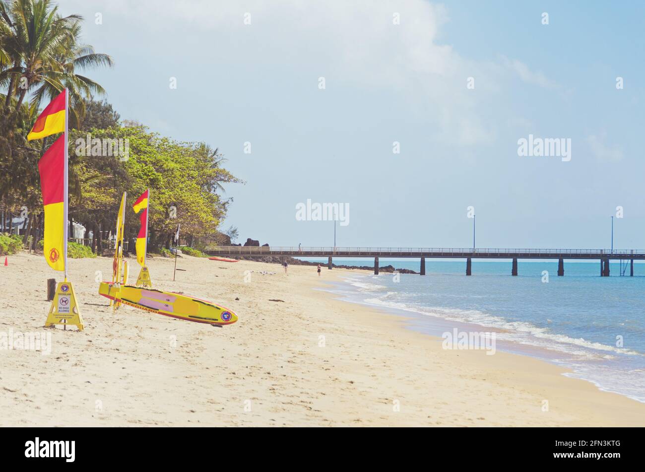 Surf life saving flags along the beach at Palm Cove, Queensland ...