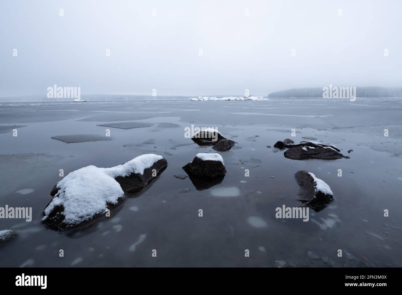 Snow on a partly frozen lake hi-res stock photography and images - Alamy