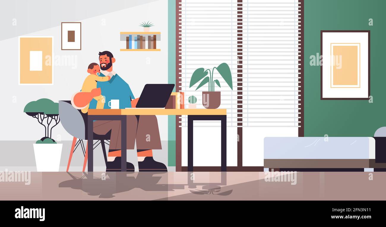 father sitting at workplace with little son fatherhood parenting ...