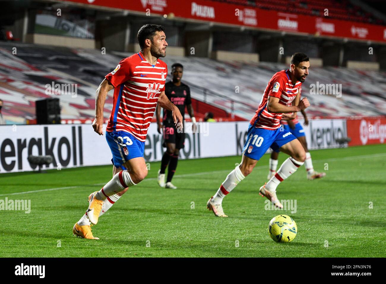 Granada, Spain. 13th May, 2021. Granada CF players Jorge Molina and ...