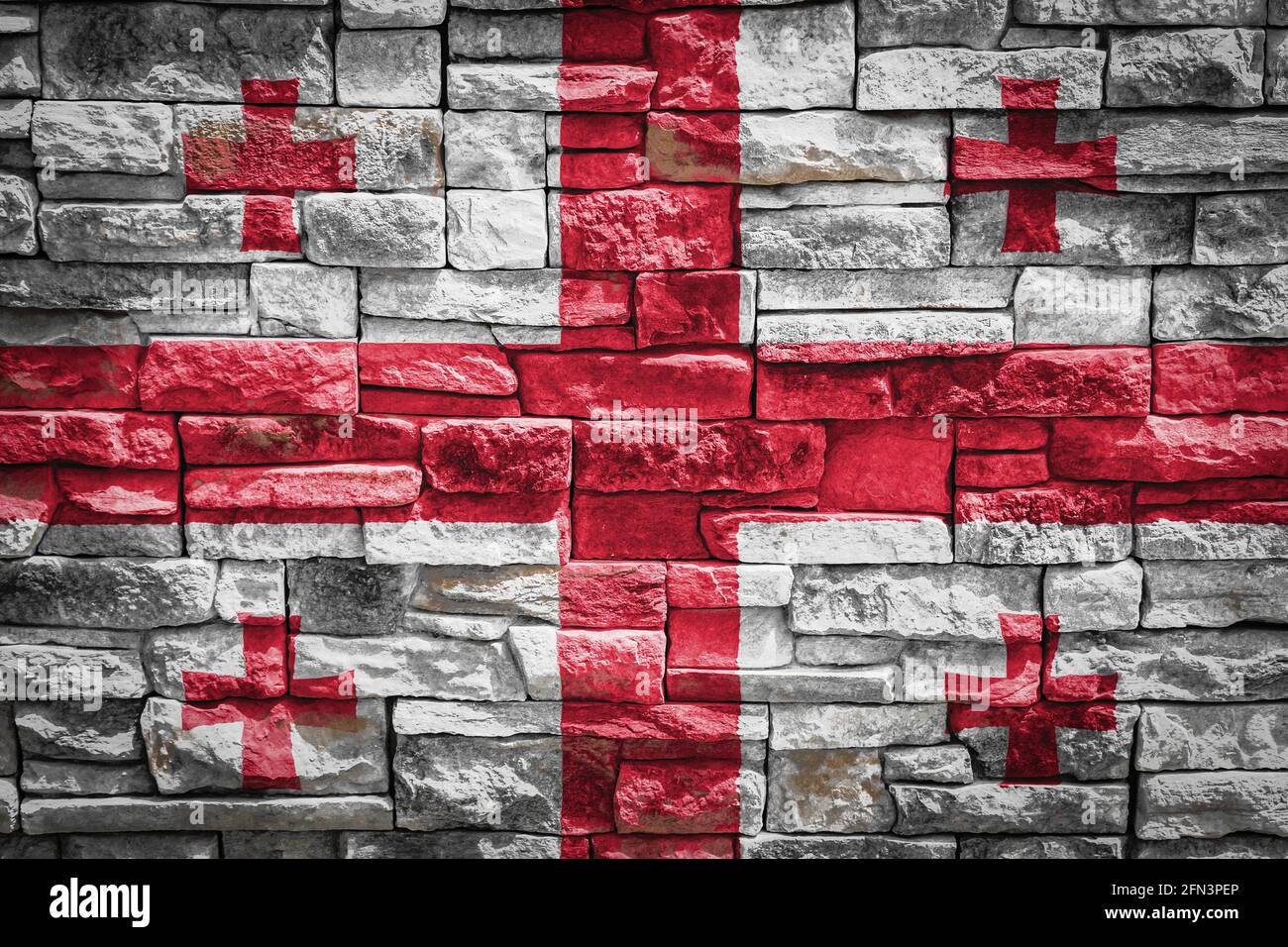 National flag of Georgia on stone wall background.The concept of ...