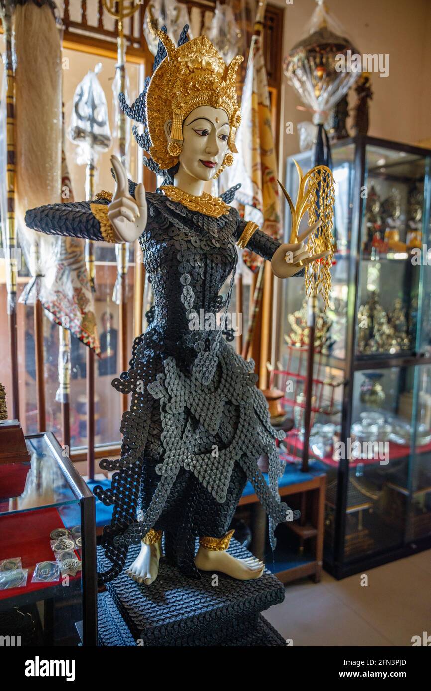 Statue of Balinese traditional dancer made of hollowed coins (kepeng ...