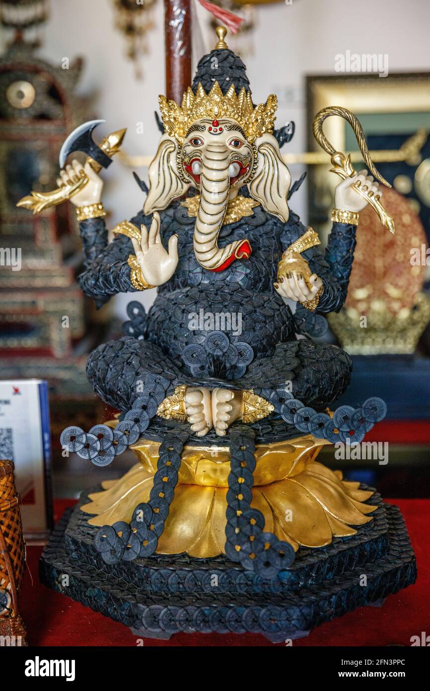 Statue of Ganesha made of hollowed coins (kepeng, or pis bolong) and ...