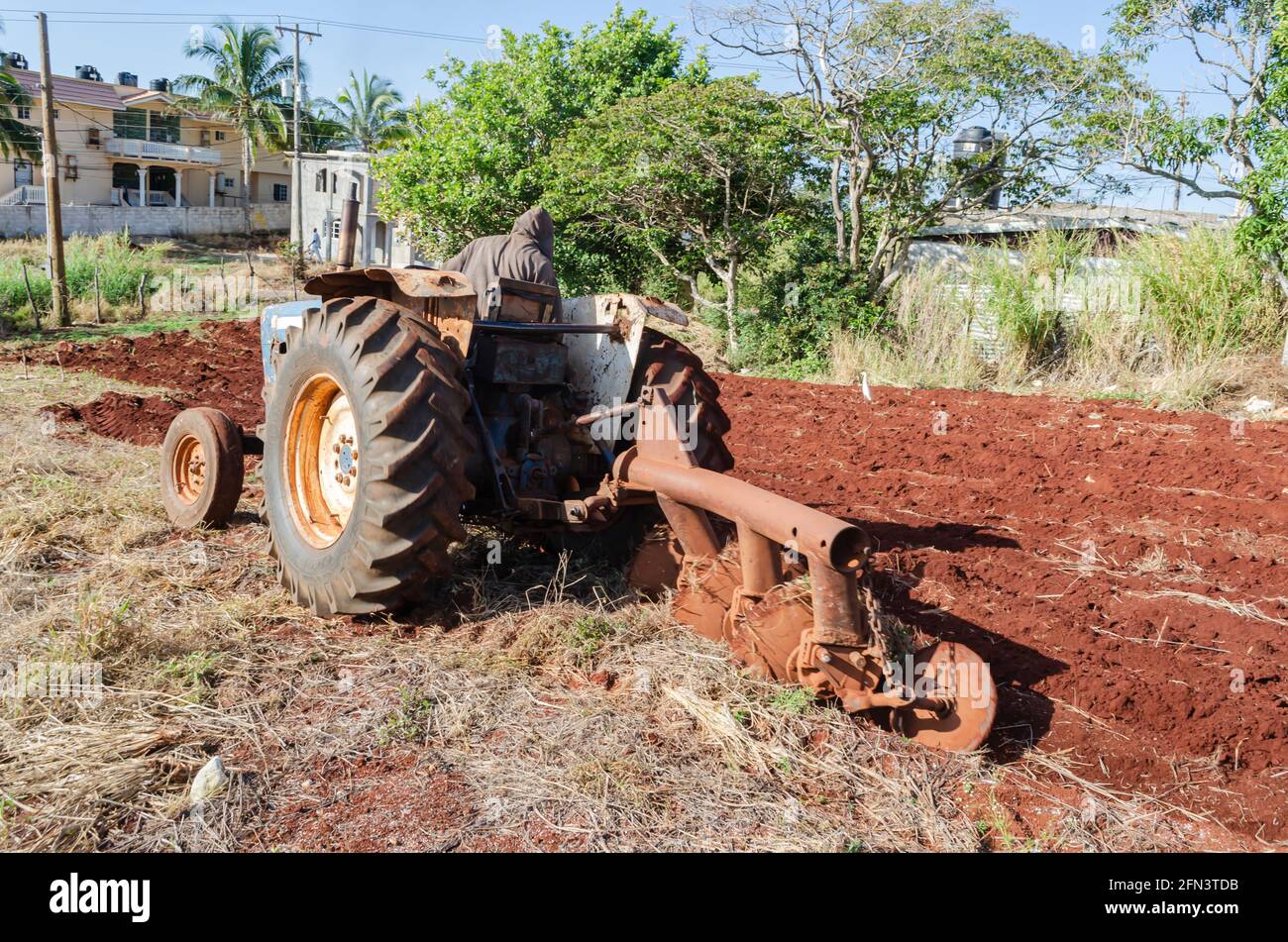 Back Of Tractor Plowing Land For Farm Stock Photo - Alamy
