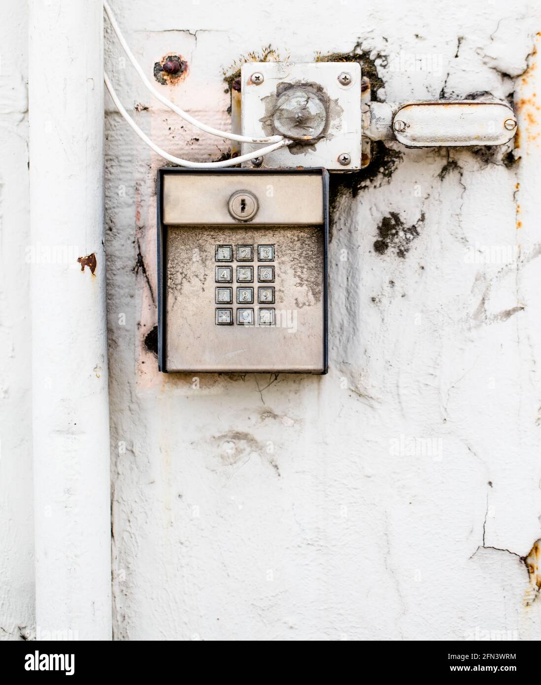 Old security alarm key pad Stock Photo - Alamy
