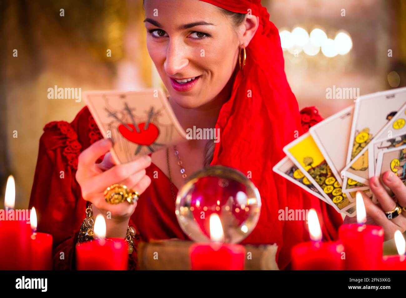 Fortuneteller with Tarot cards or esoteric Oracle, sees in the future ...