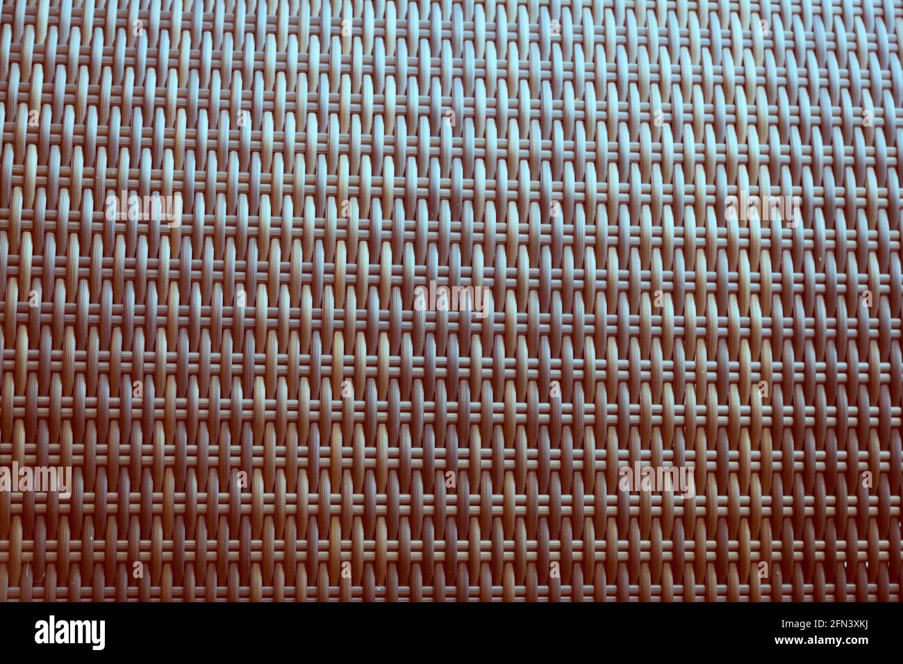 Synthetic rattan texture weaving background as used on outdoor garden ...