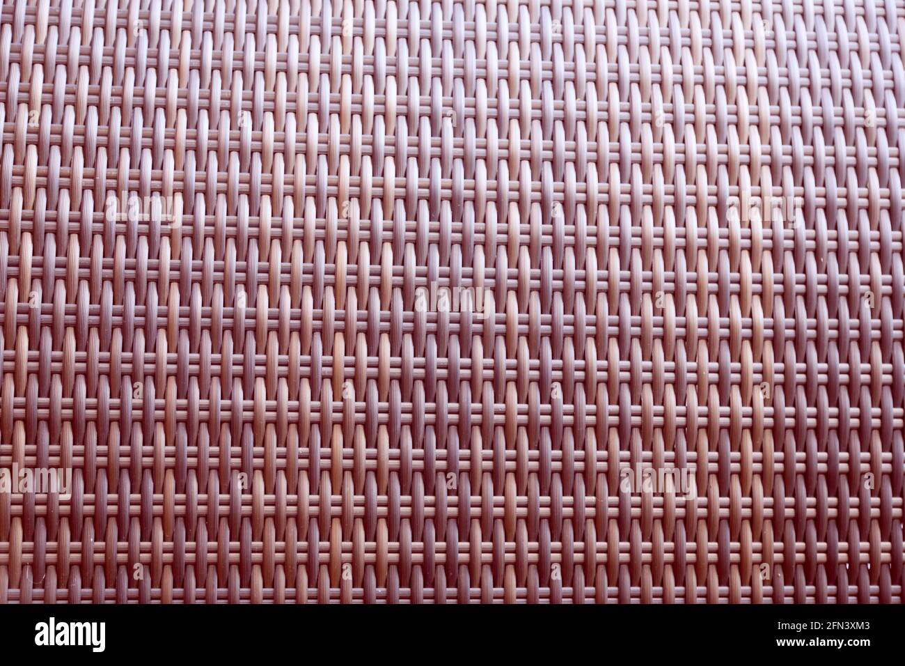 Synthetic rattan texture weaving background as used on outdoor garden ...