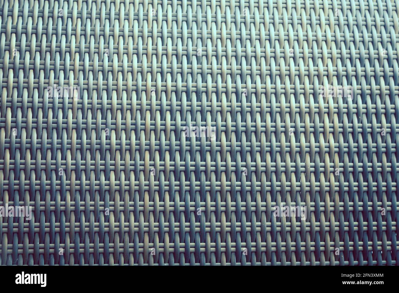 Synthetic rattan texture weaving background as used on outdoor garden ...