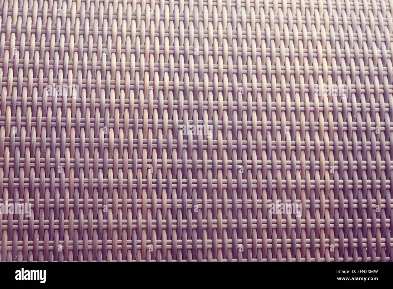 Synthetic rattan texture weaving background as used on outdoor garden ...
