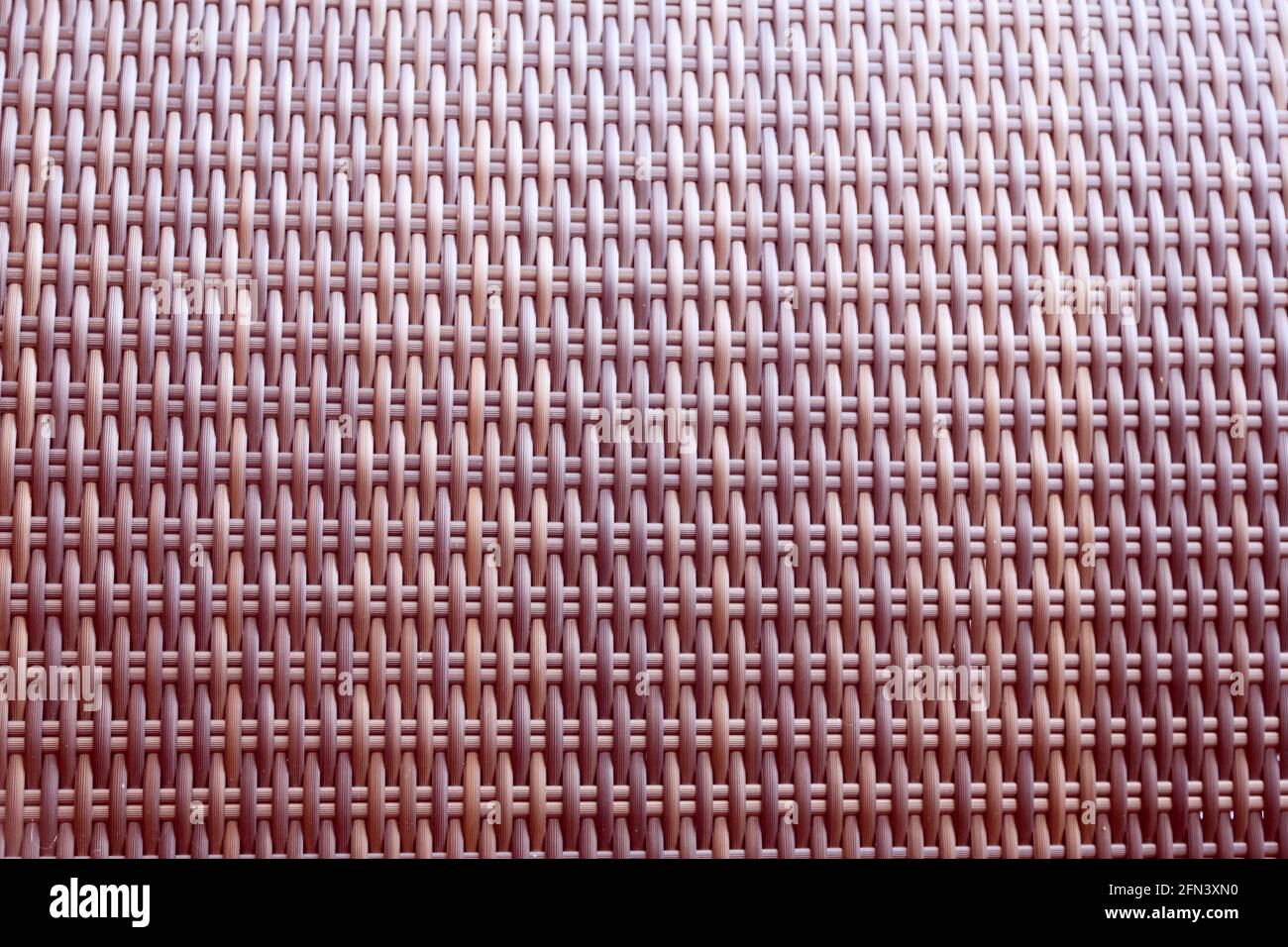 Synthetic rattan texture weaving background as used on outdoor garden ...
