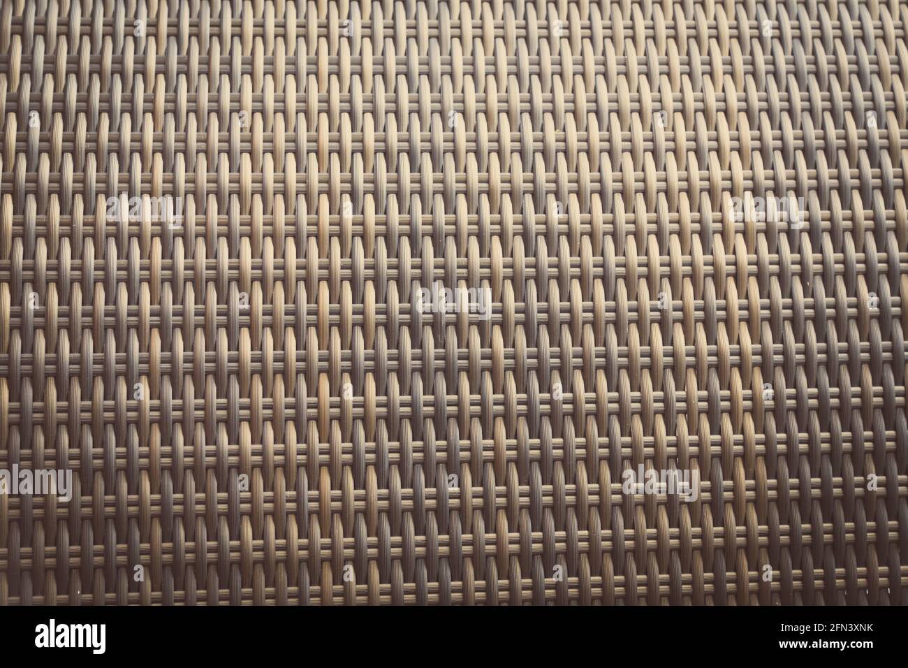 Synthetic rattan texture weaving background as used on outdoor garden ...
