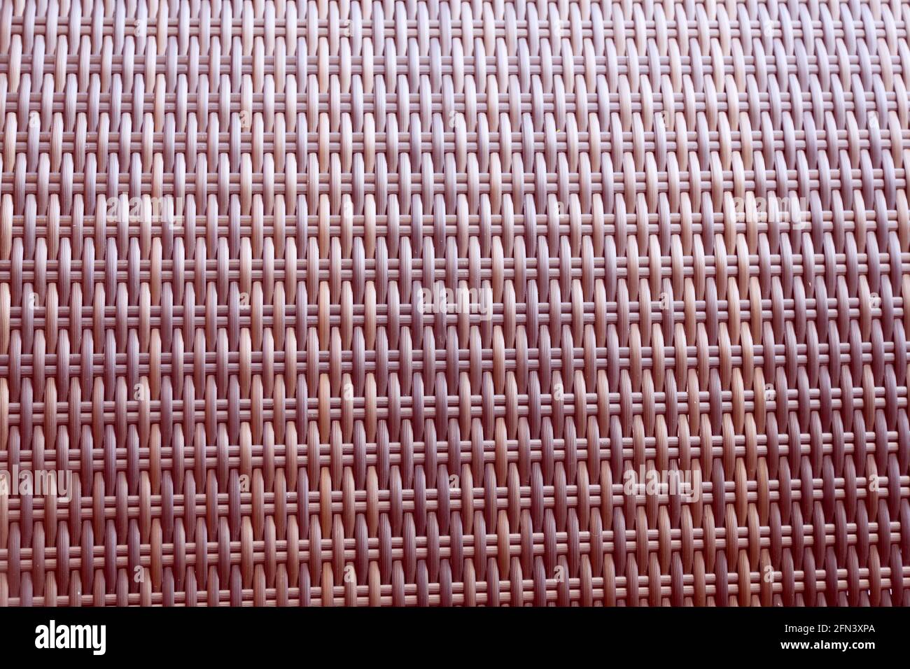 Synthetic rattan texture weaving background as used on outdoor garden ...