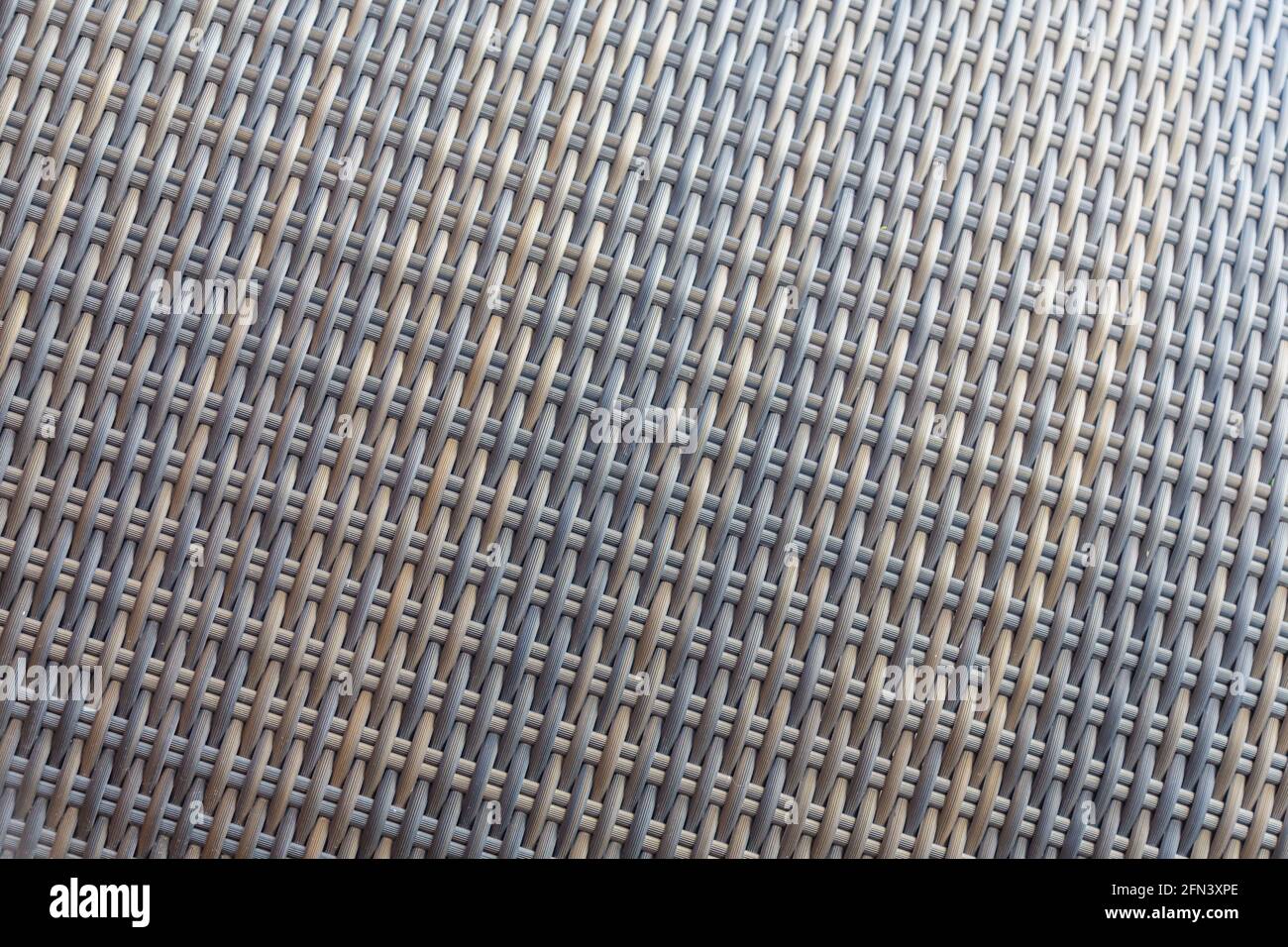 Synthetic rattan texture weaving background as used on outdoor garden ...