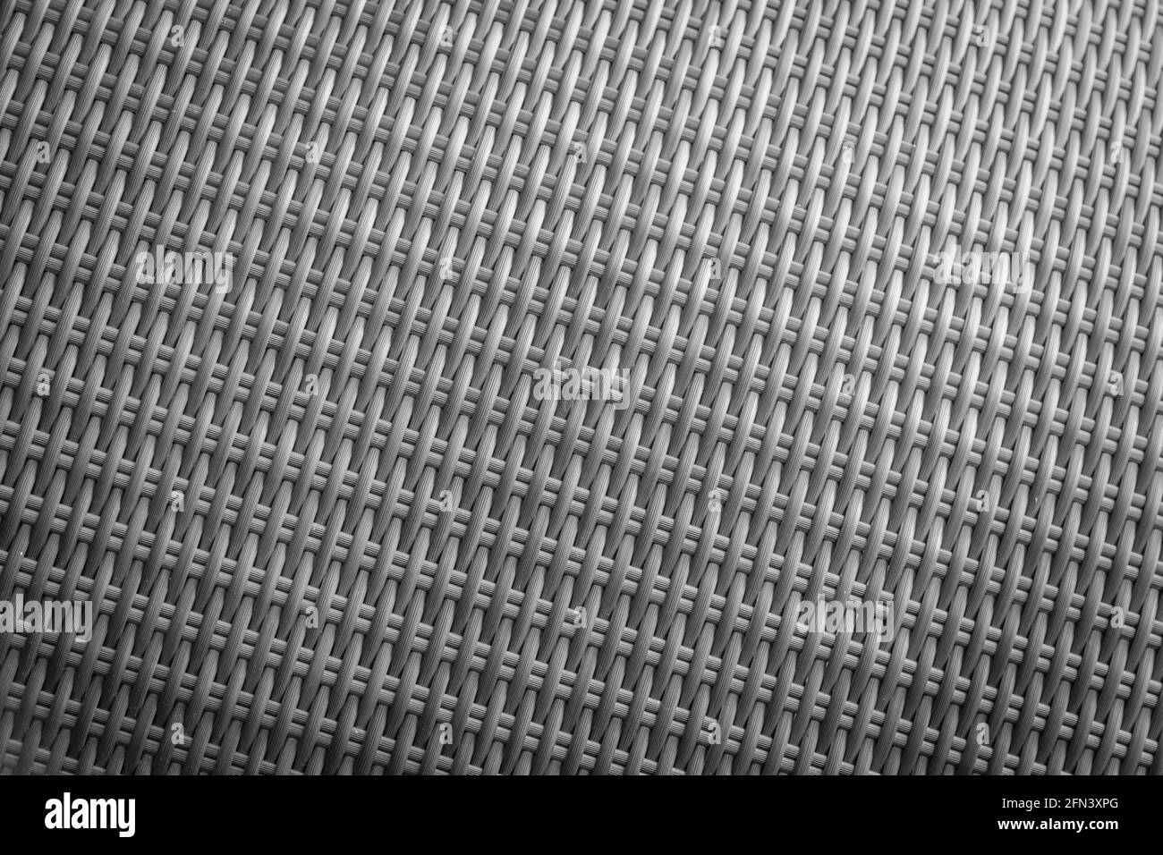 Synthetic rattan texture weaving background as used on outdoor garden ...