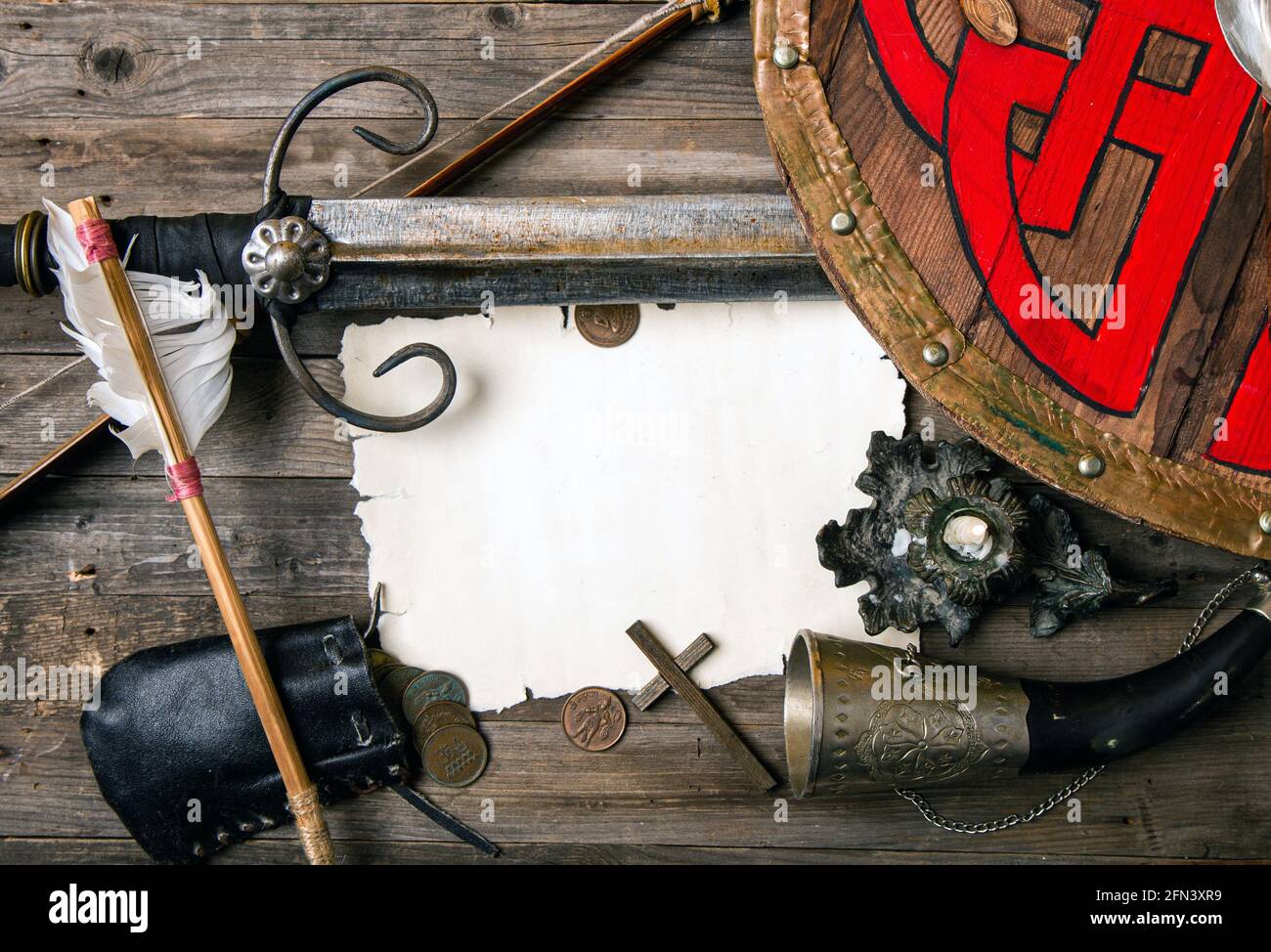 Vintage medieval background with sword and shield coins and other ...