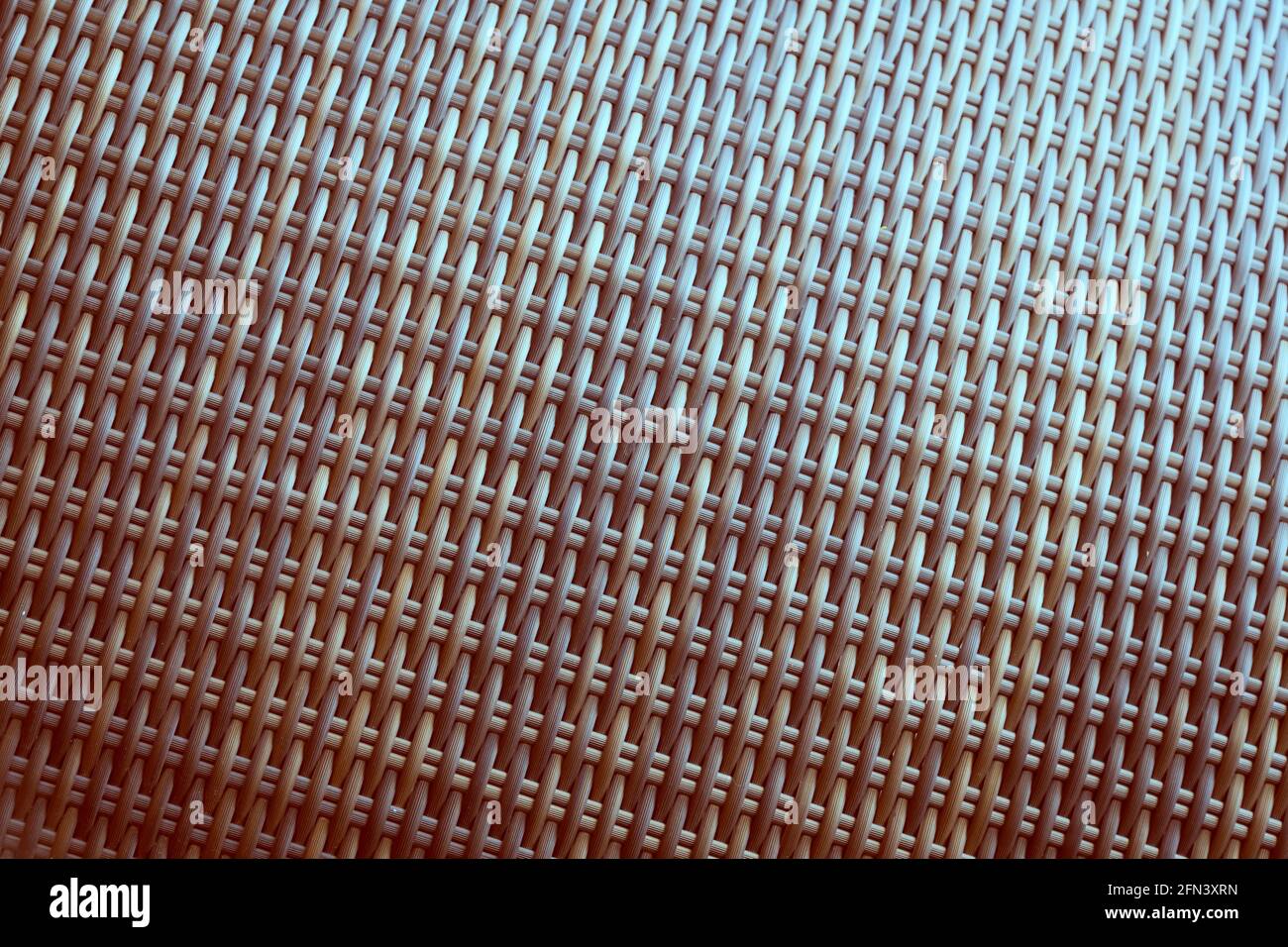 Synthetic rattan texture weaving background as used on outdoor garden ...