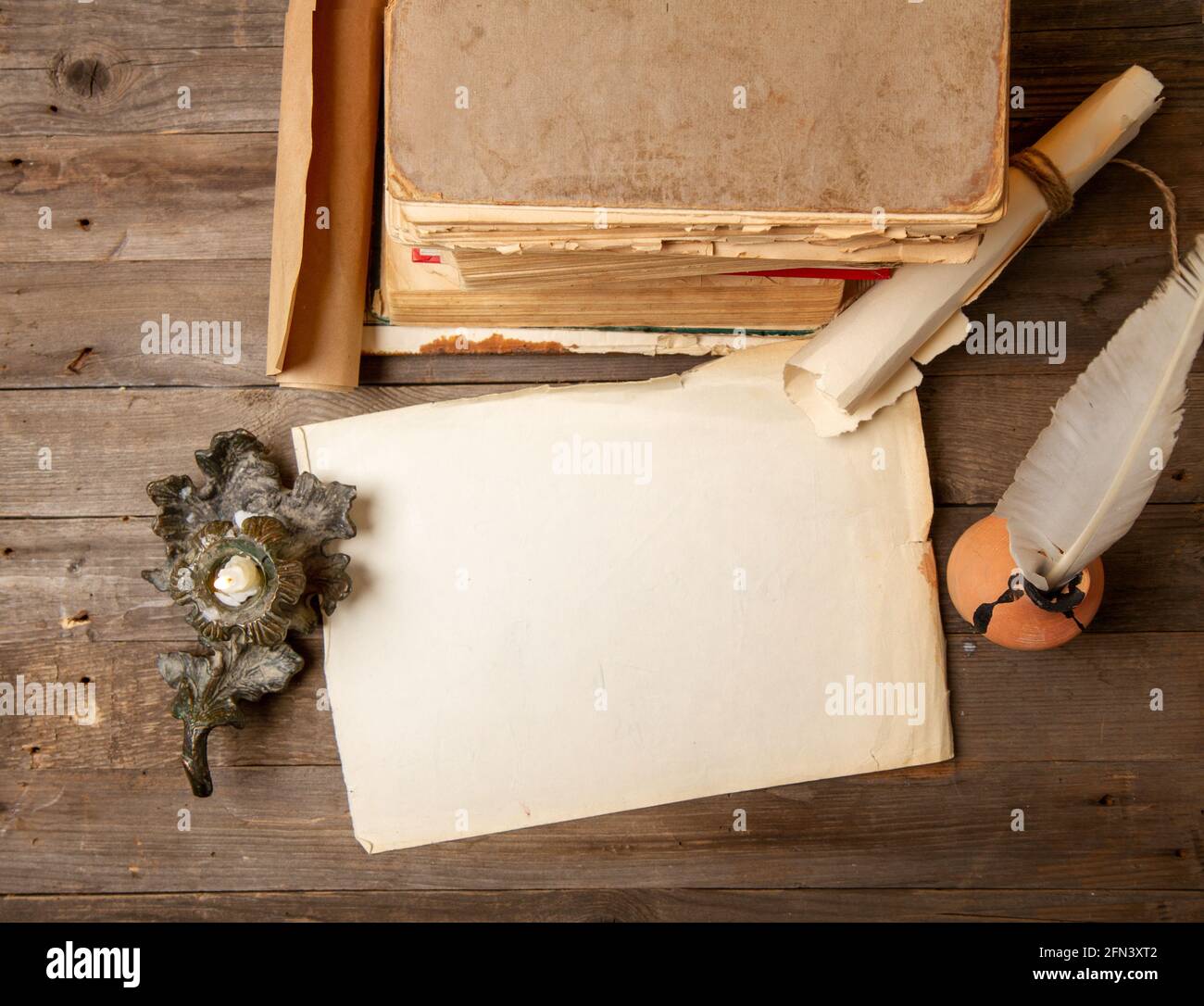 Vintage medieval background with books scrolls inkwell and quill pen on ...