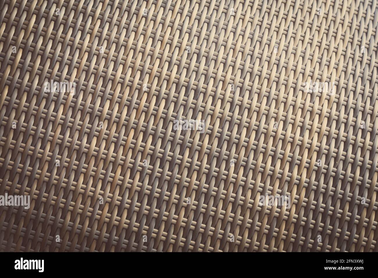 Synthetic rattan texture weaving background as used on outdoor garden ...
