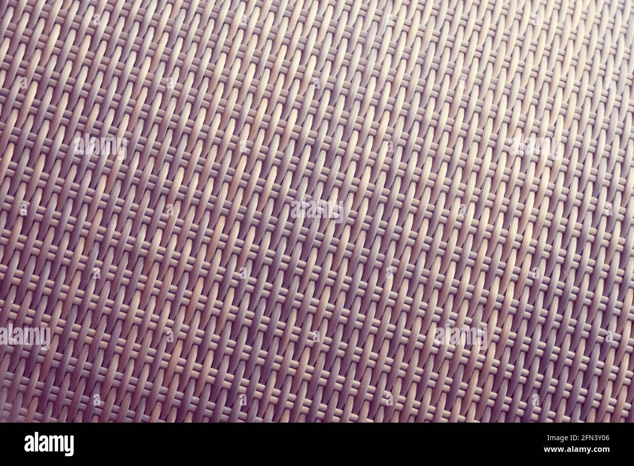 Synthetic rattan texture weaving background as used on outdoor garden ...