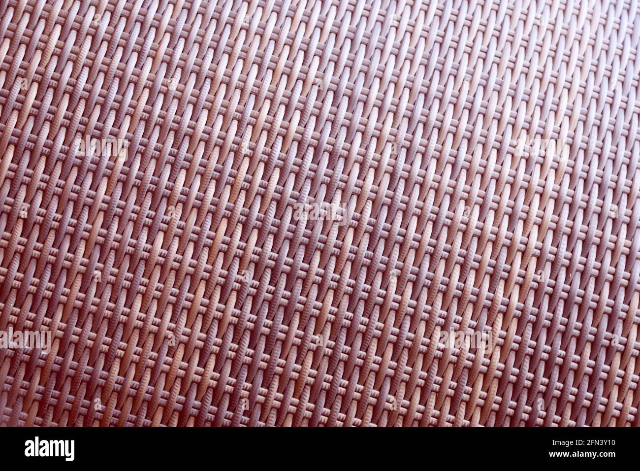 Synthetic rattan texture weaving background as used on outdoor garden ...