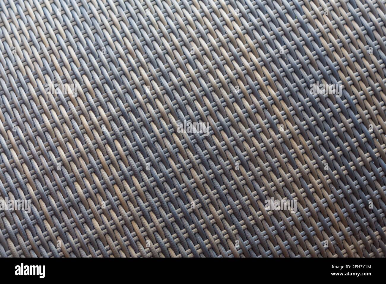 Synthetic rattan texture weaving background as used on outdoor garden ...