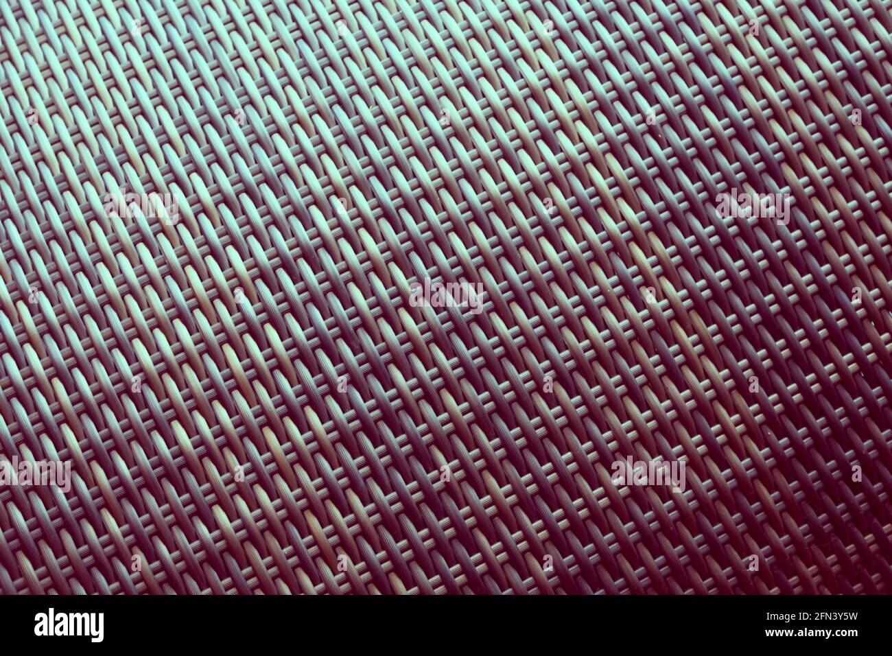 Synthetic rattan texture weaving background as used on outdoor garden ...