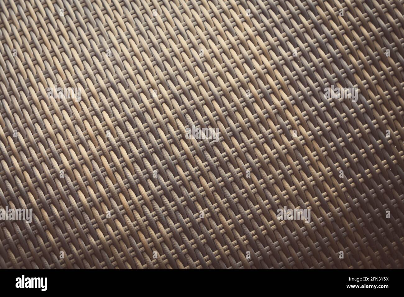 Synthetic rattan texture weaving background as used on outdoor garden ...